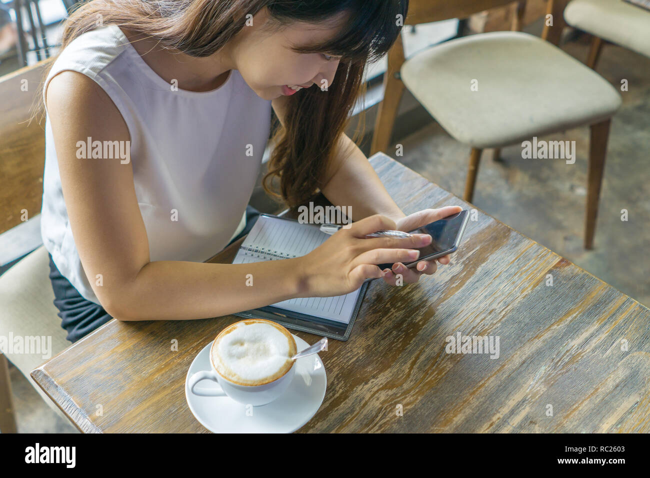Tapping smartphone hi-res stock photography and images - Alamy