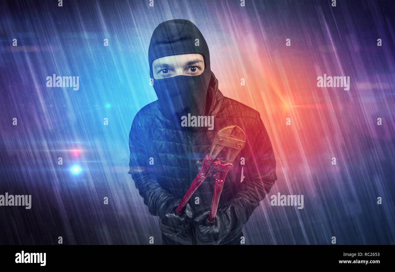 Burglar in action with colorful concept Stock Photo - Alamy