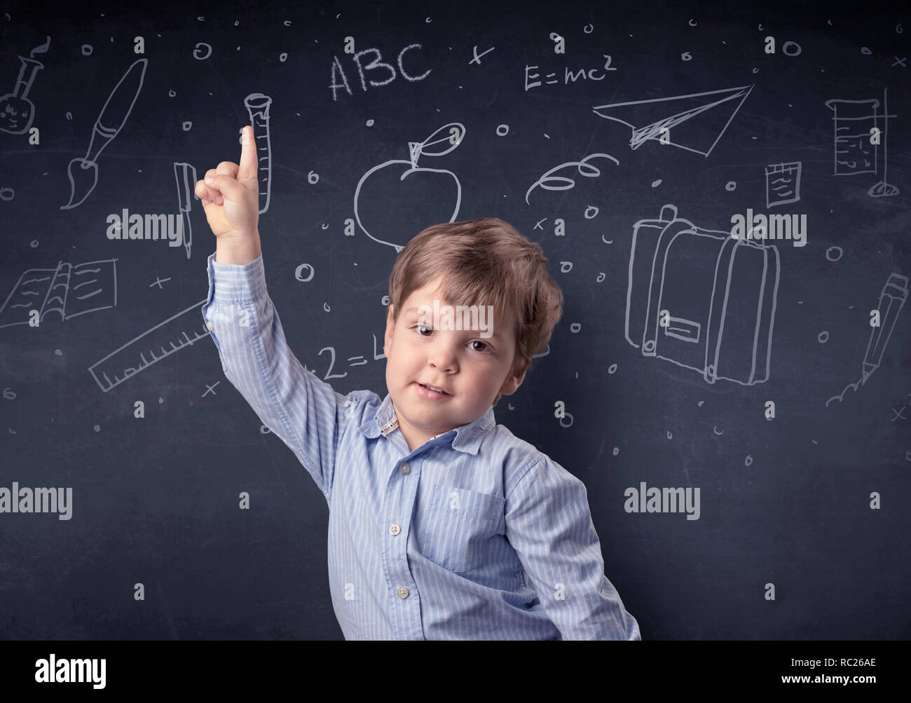 Smart little kid in front of a drawn up blackboard ruminate Stock Photo ...