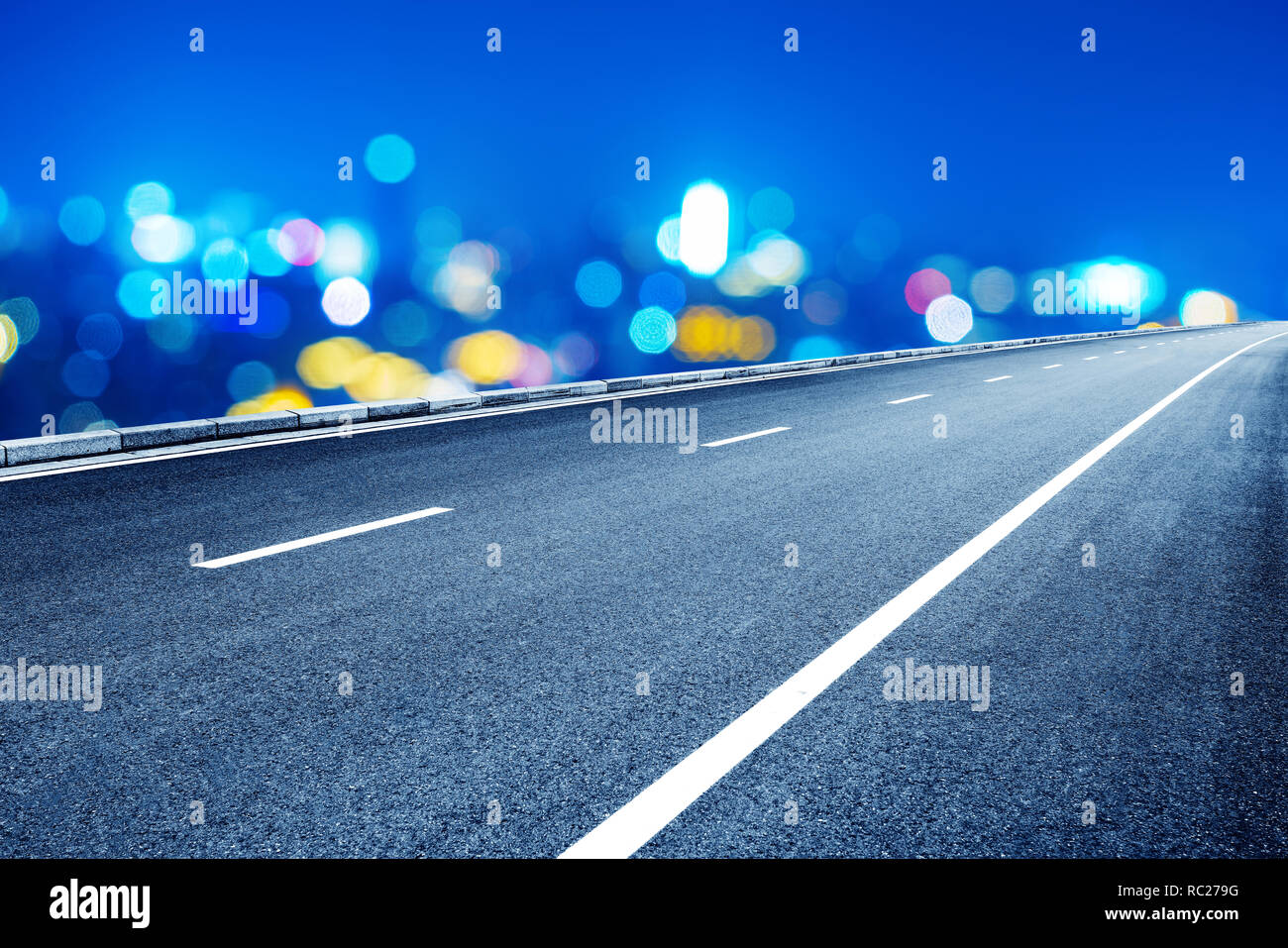 City night view, asphalt road in front of lights Stock Photo - Alamy