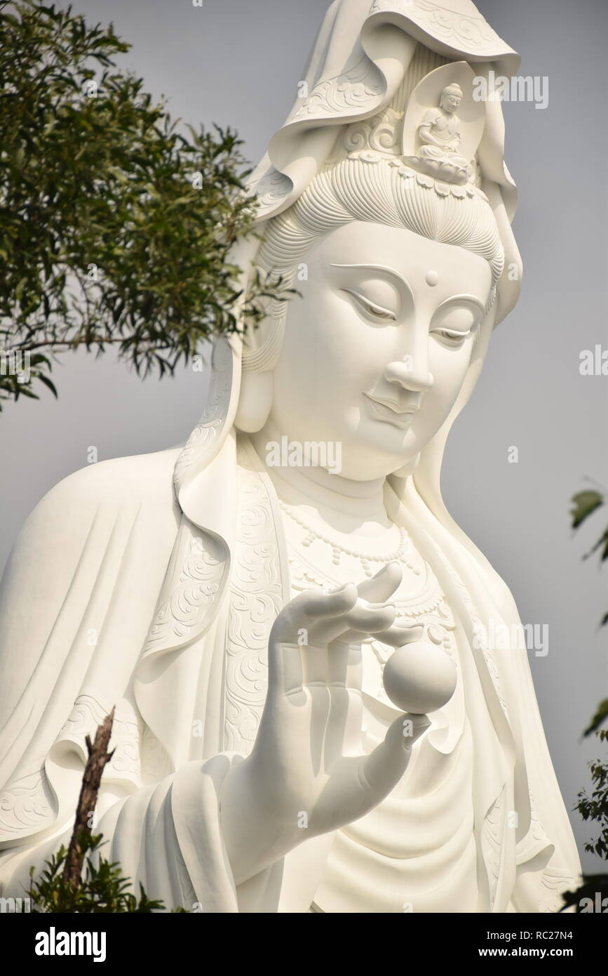 Close up of the bronze Guanyin statue outside Tsz Shan buddhist monastery in Tai Po, Hong Kong ...