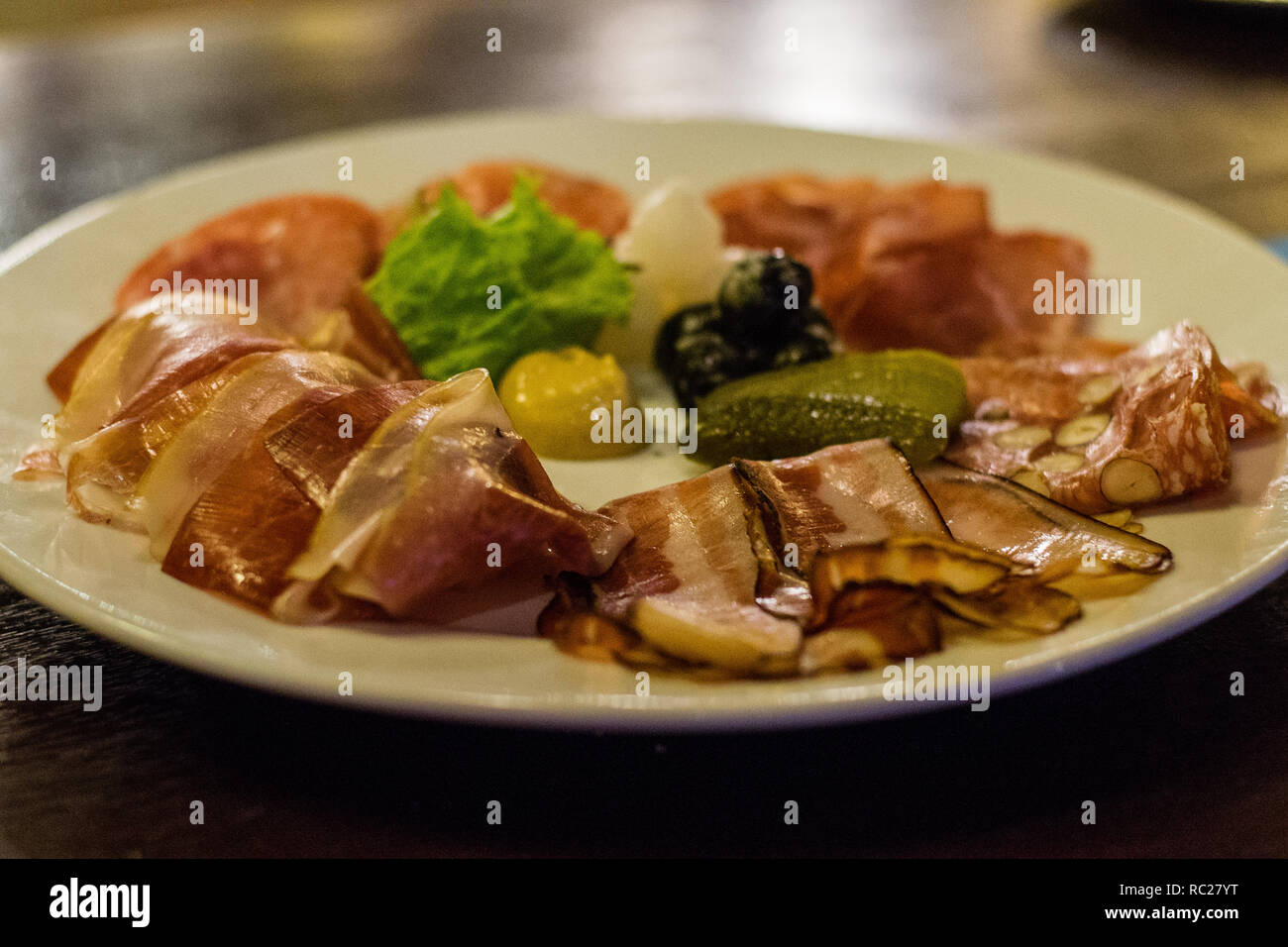 cold cut meat platter with mustard, gherkins, pickles and pickled ...