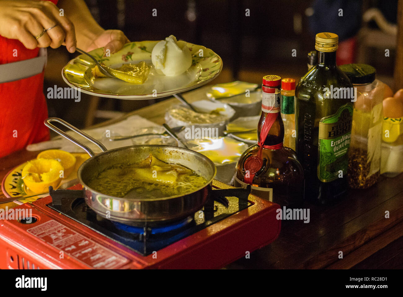 Live cooking of french dessert crepe suzette Stock Photo - Alamy