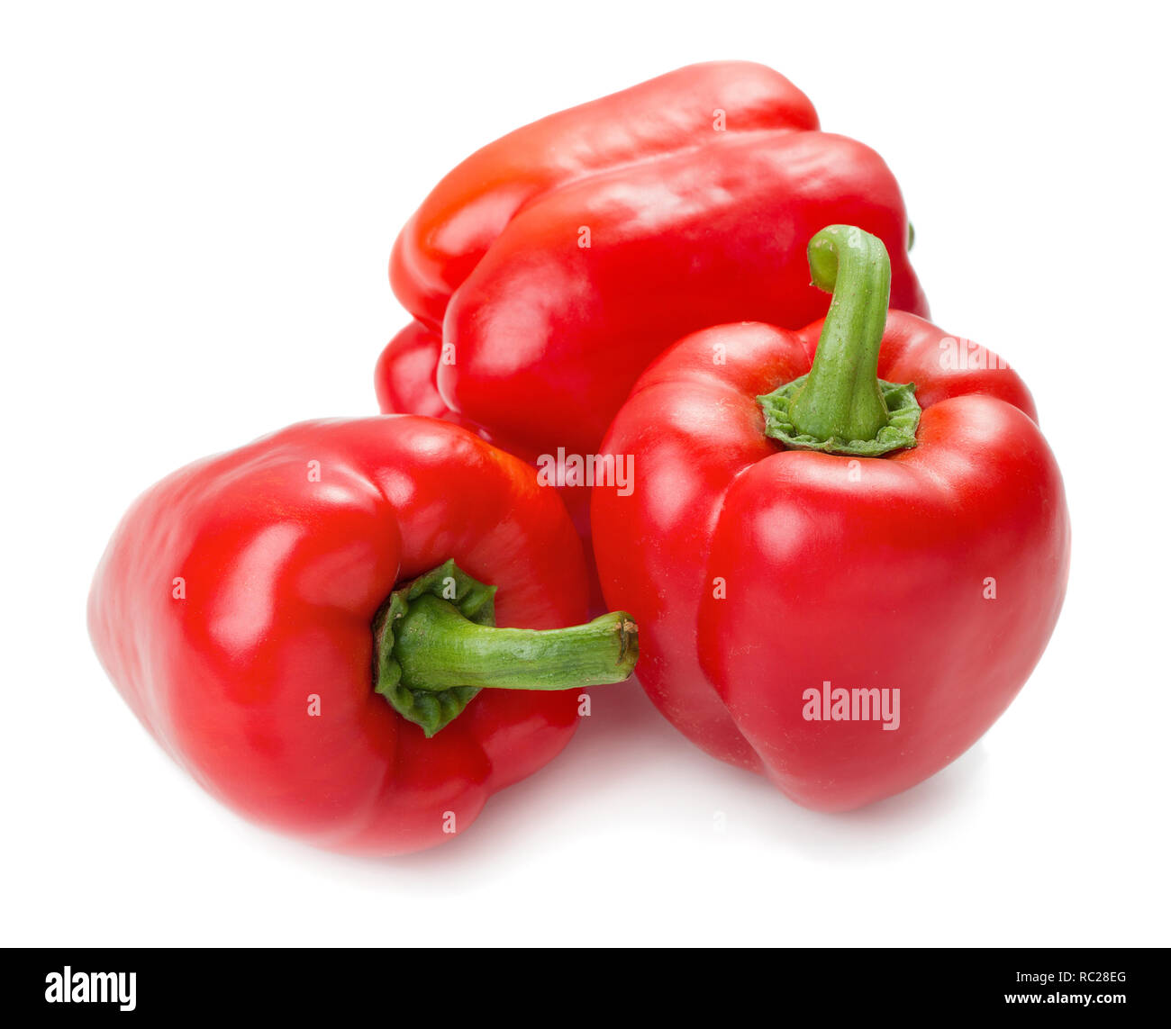three red peppers isolated on white background Stock Photo - Alamy