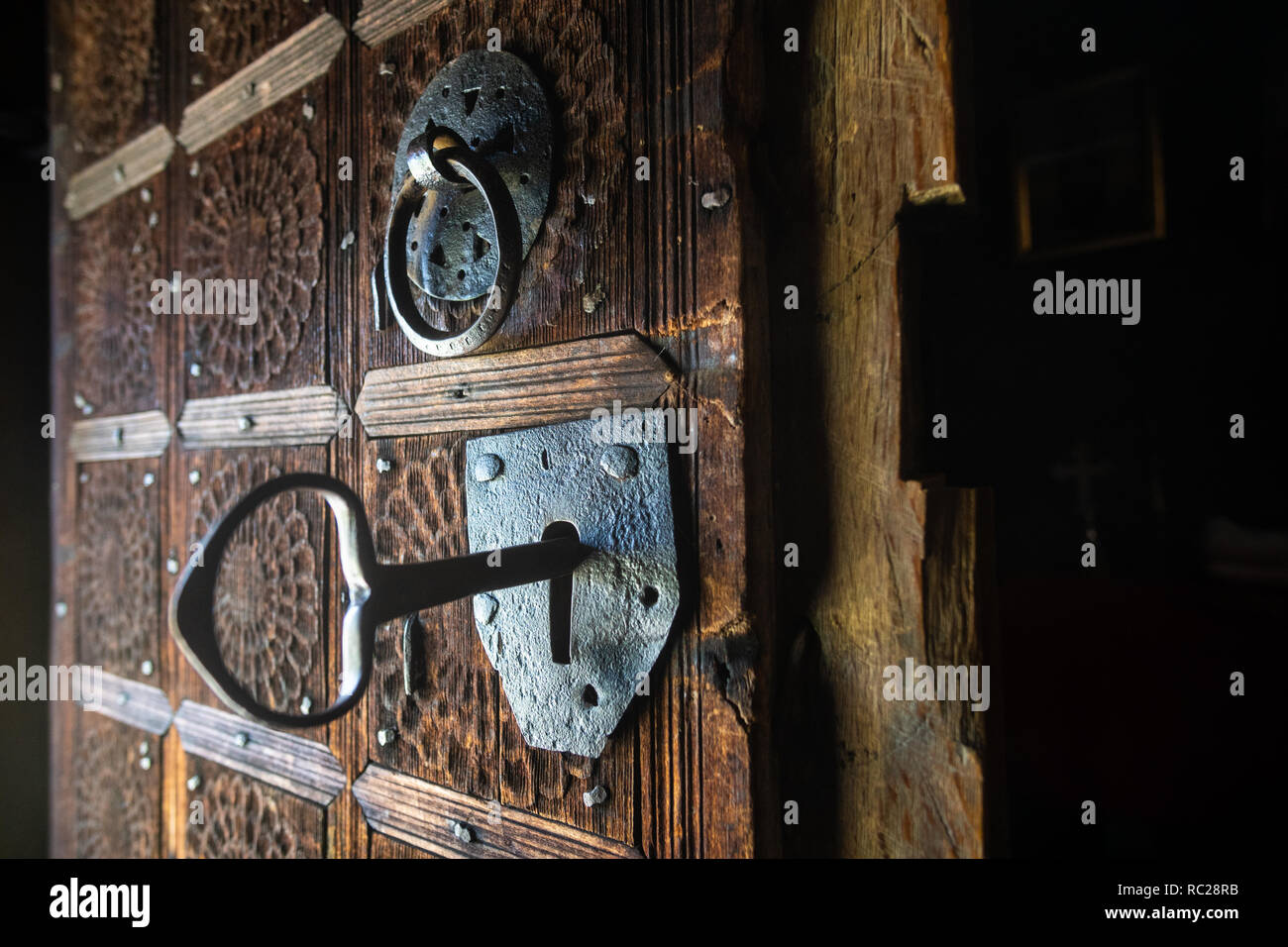 Big key in rustic door of wooden church Stock Photo - Alamy