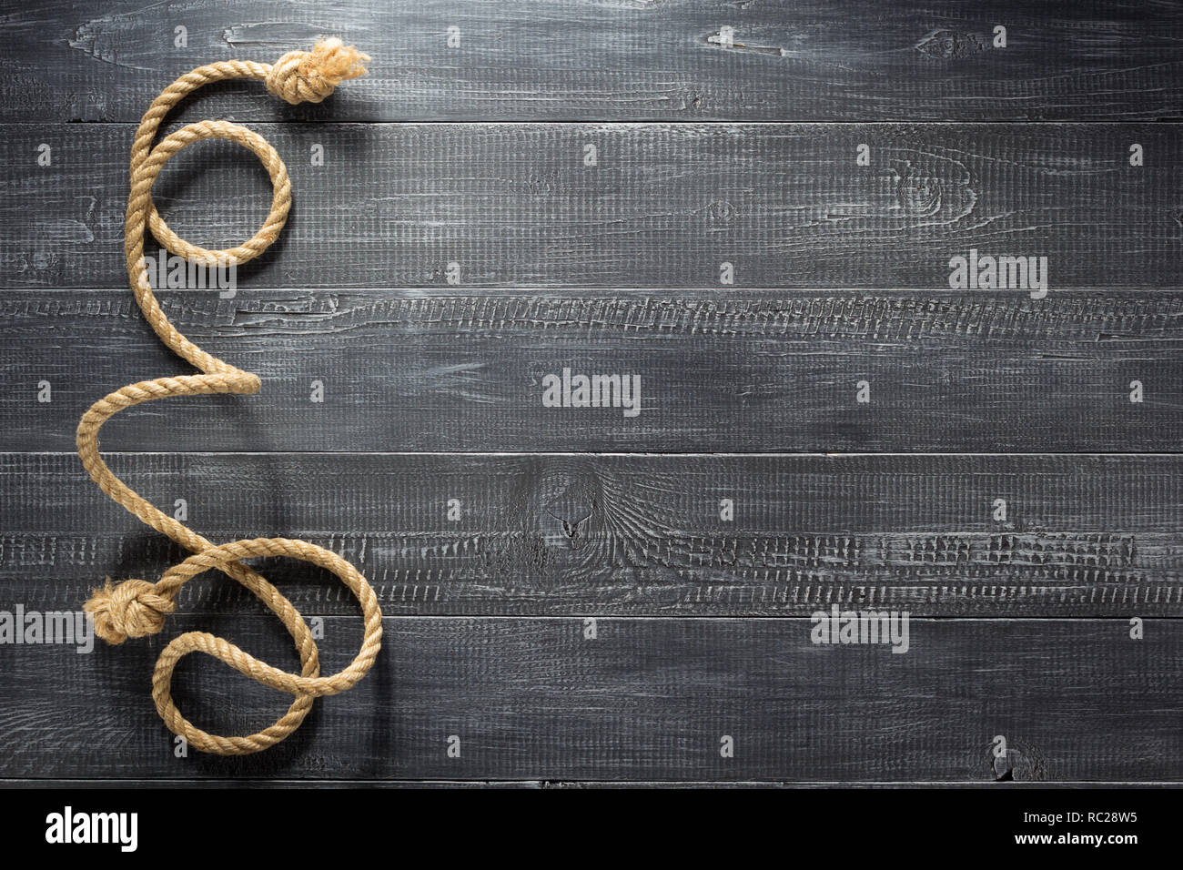 ship rope at wooden background texture Stock Photo - Alamy