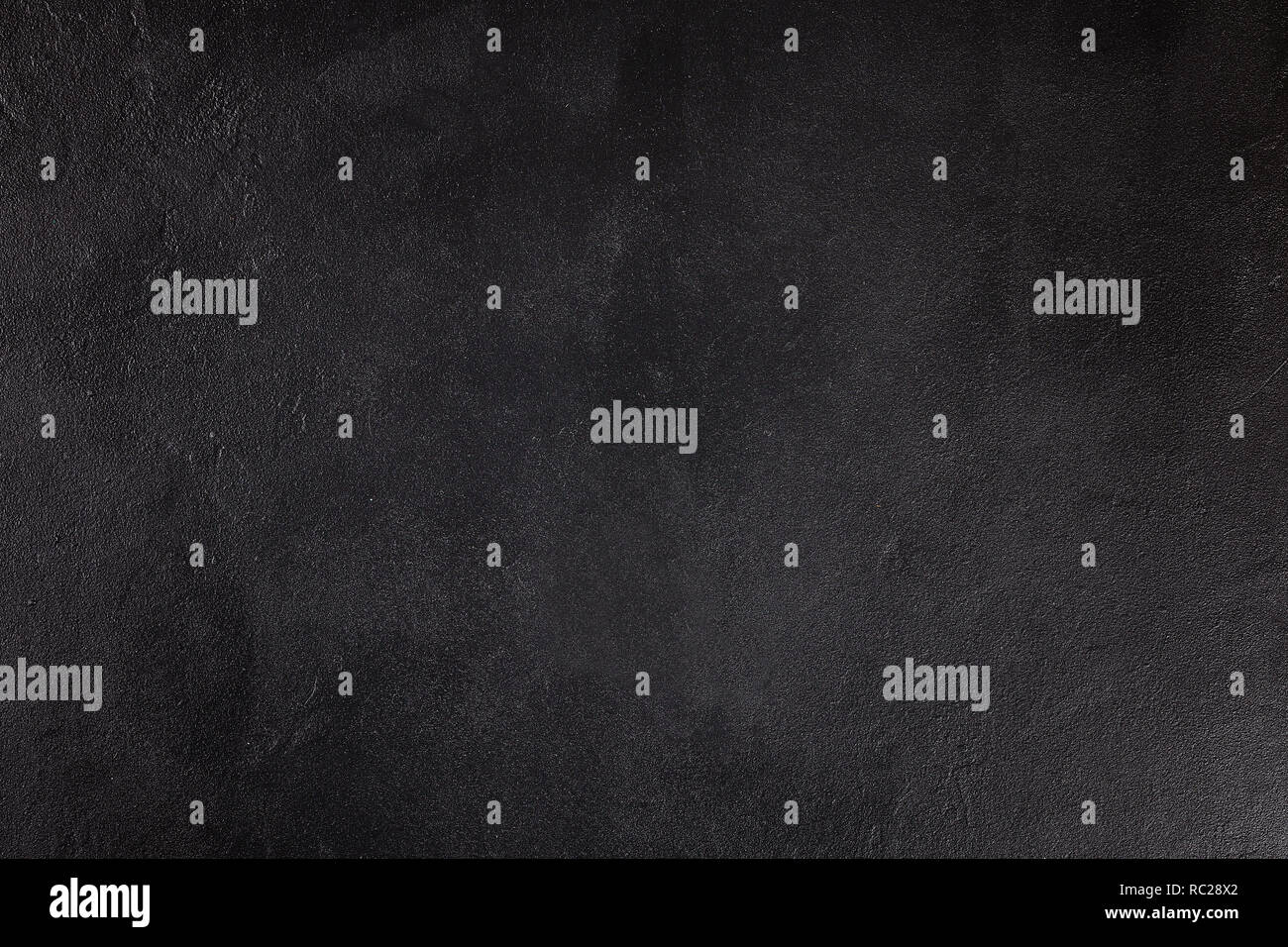 The texture of concrete. Fragment of black concrete. Top view. Painted ...