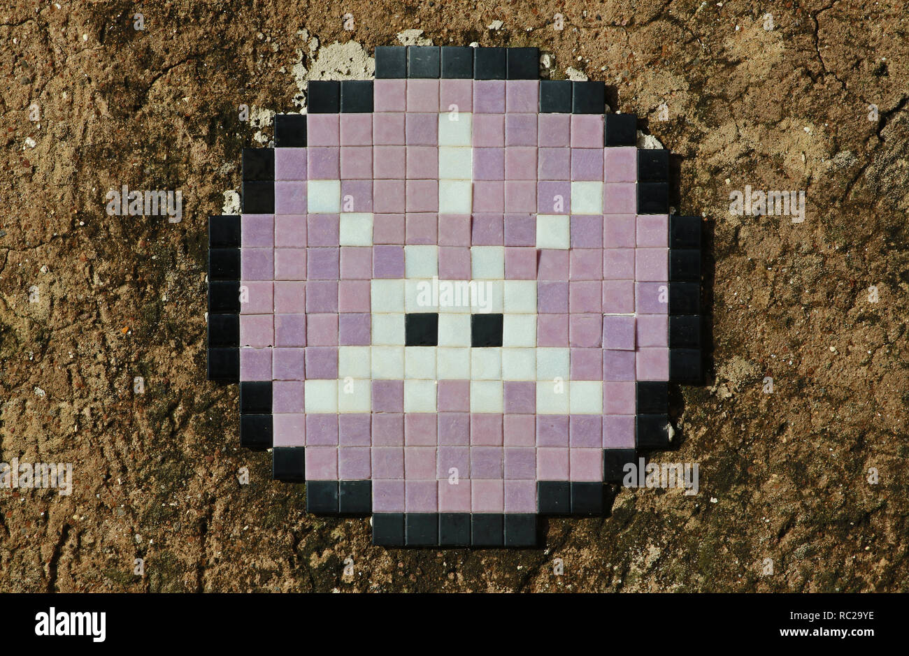 Invader art or space invader art street mosaic on a wall in Rome by the ...