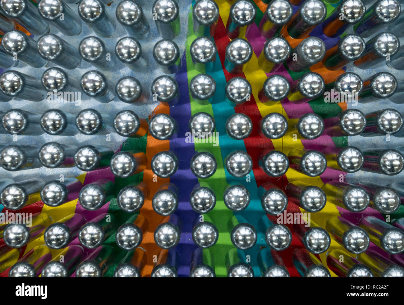 Cream chargers / nitrous oxide cannisters reflecting colourful ...