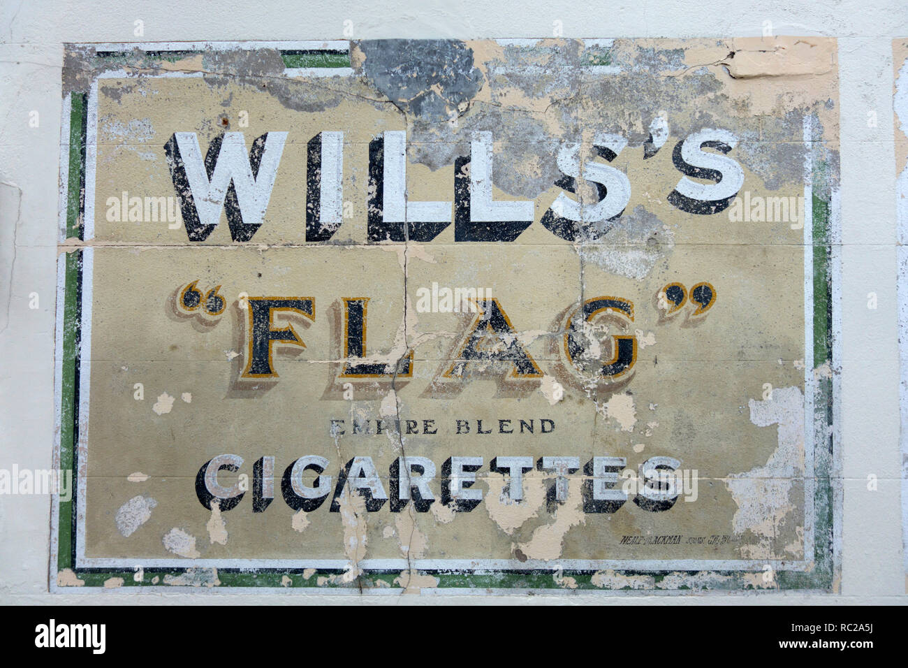 Old Wills's "Flag" cigarettes advert on wall, Whitstable Stock Photo ...
