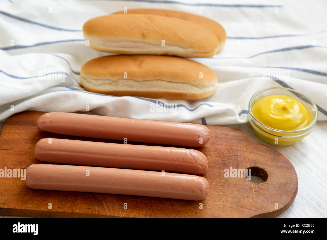 Ingredients for making hot dogs: sausages, hot-dog buns and mustard on ...