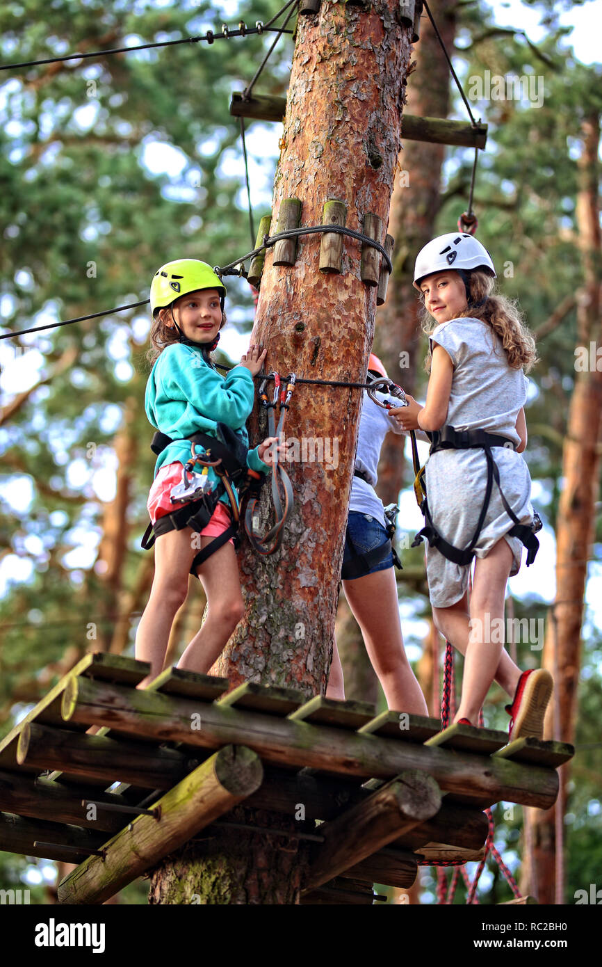 two girls on a rope park Stock Photo - Alamy