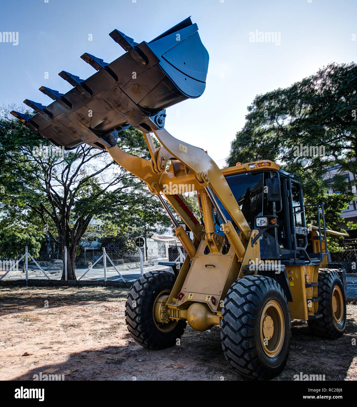 Heavy tractor working with cargo Stock Photo - Alamy