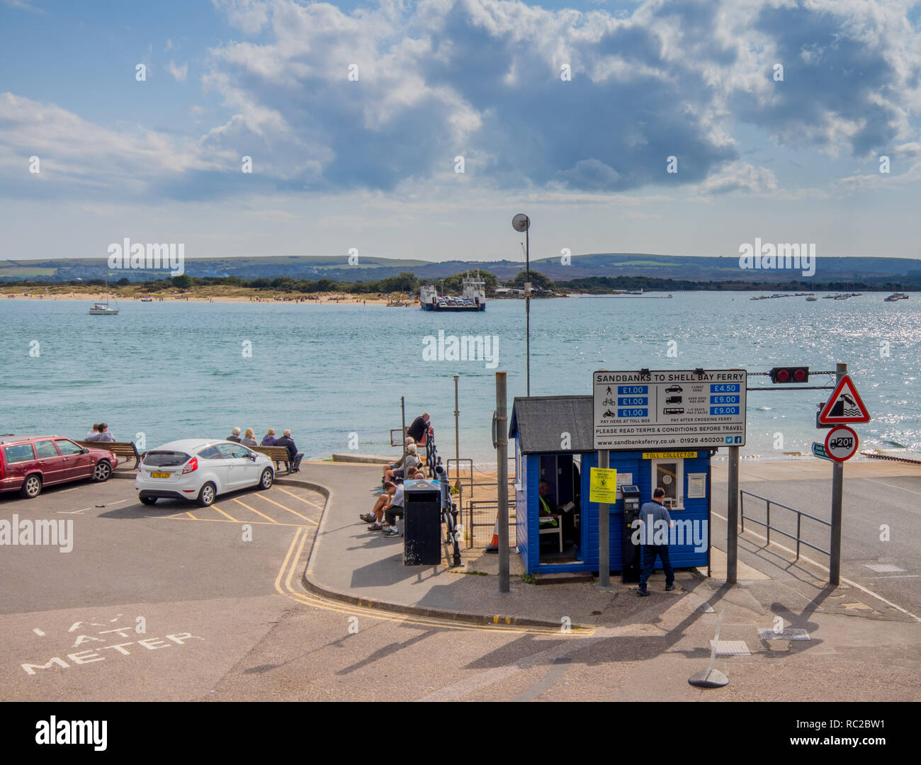 Waiting to board the Sandbanks Ferry, a vehicular chain ferry, which ...