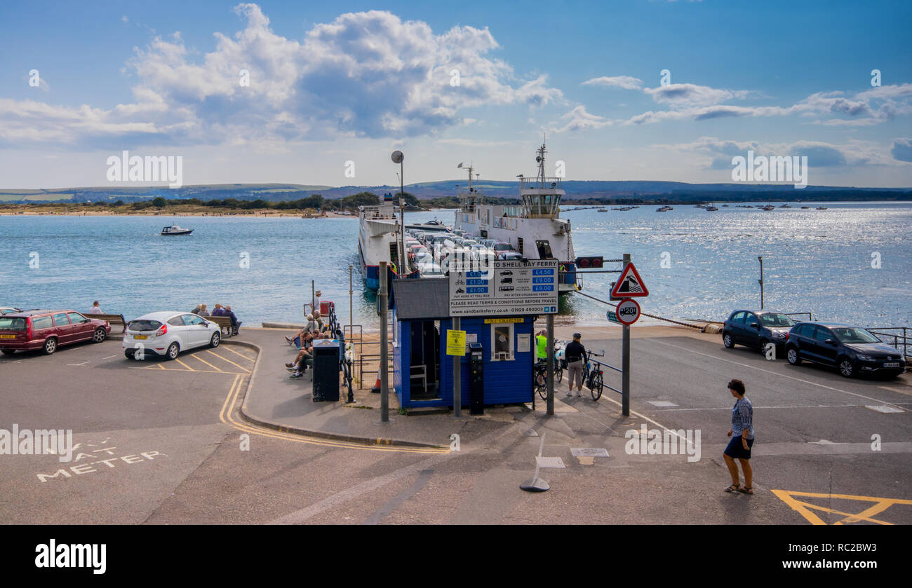 Waiting to board the Sandbanks Ferry, a vehicular chain ferry, which ...