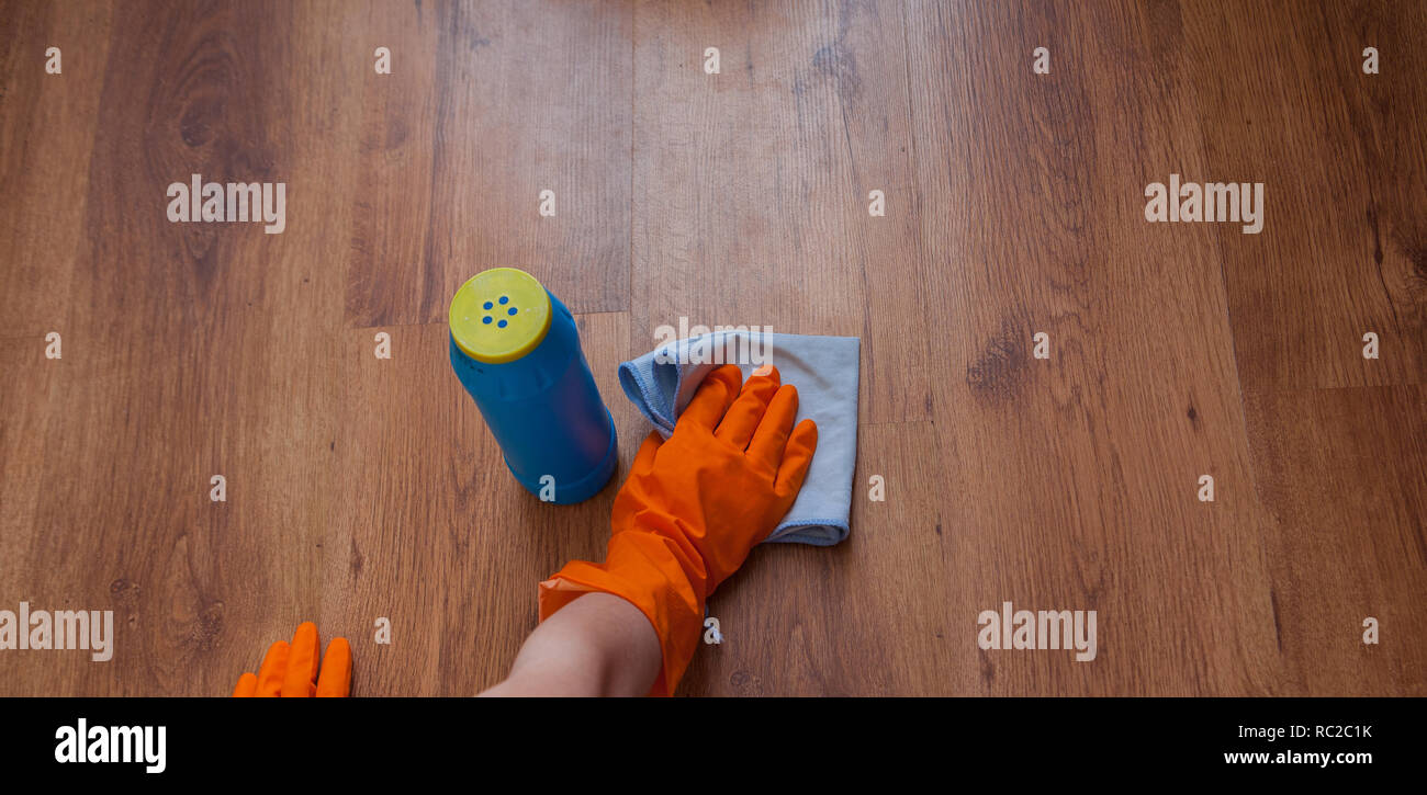 A woman hand Using blue rags wipe the wooden floor Stock Photo - Alamy