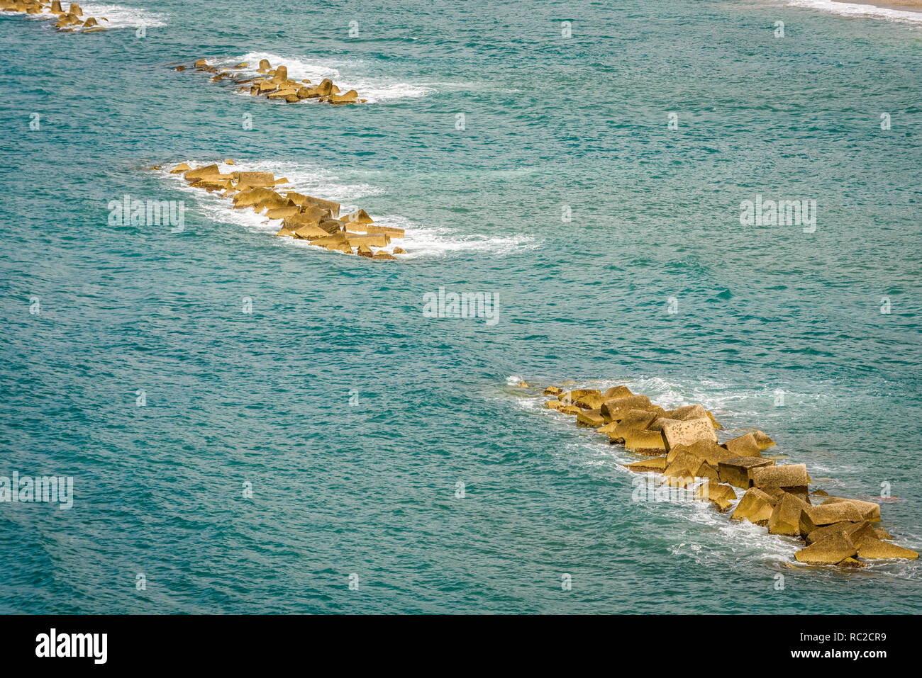 Sea waves crashing on artificial concrete breakwater. Seascape with ...