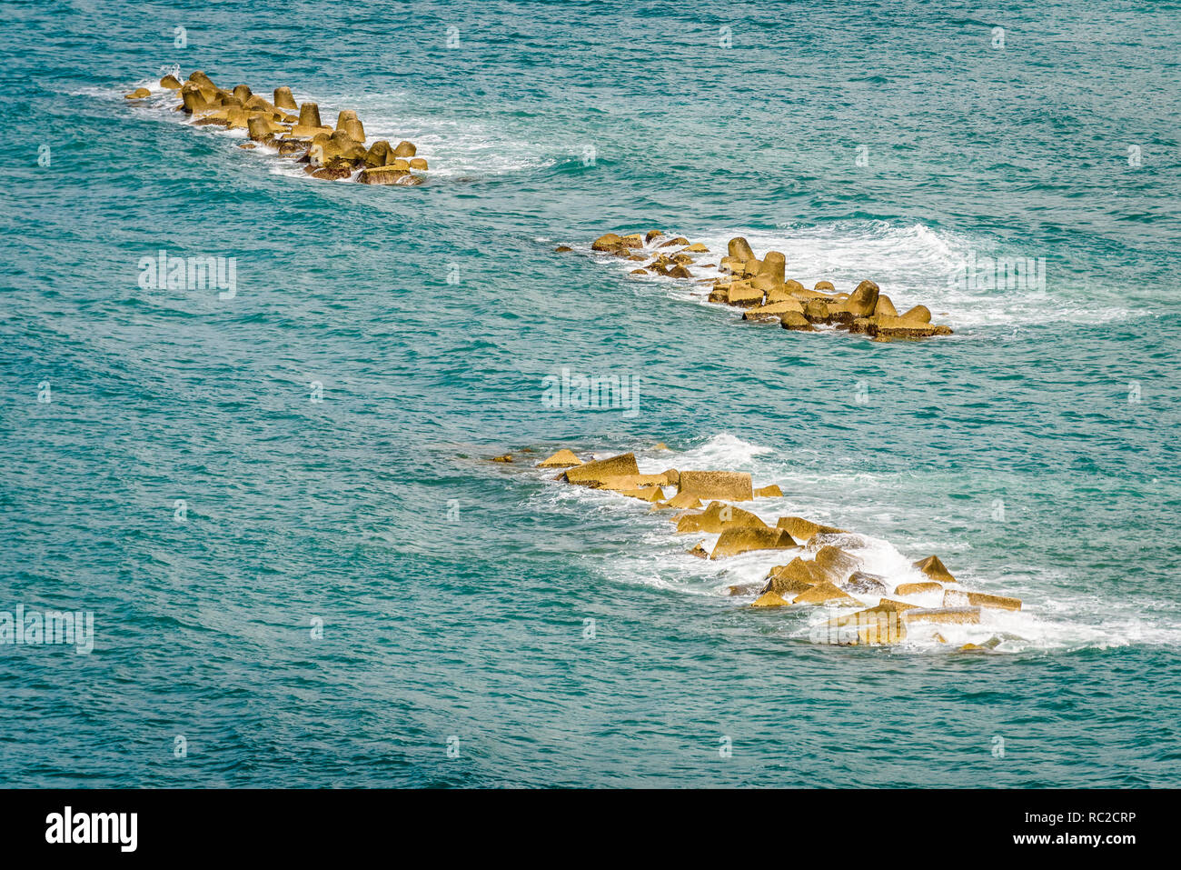 Sea waves crashing on artificial concrete breakwater. Seascape with ...