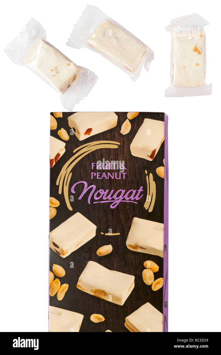 box of fruit & peanut Nougat opened to show contents set on white ...