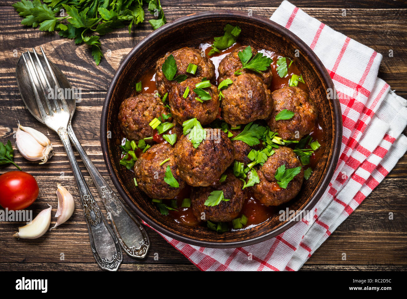Meatballs in tomato sauce on wooden table top view Stock Photo - Alamy