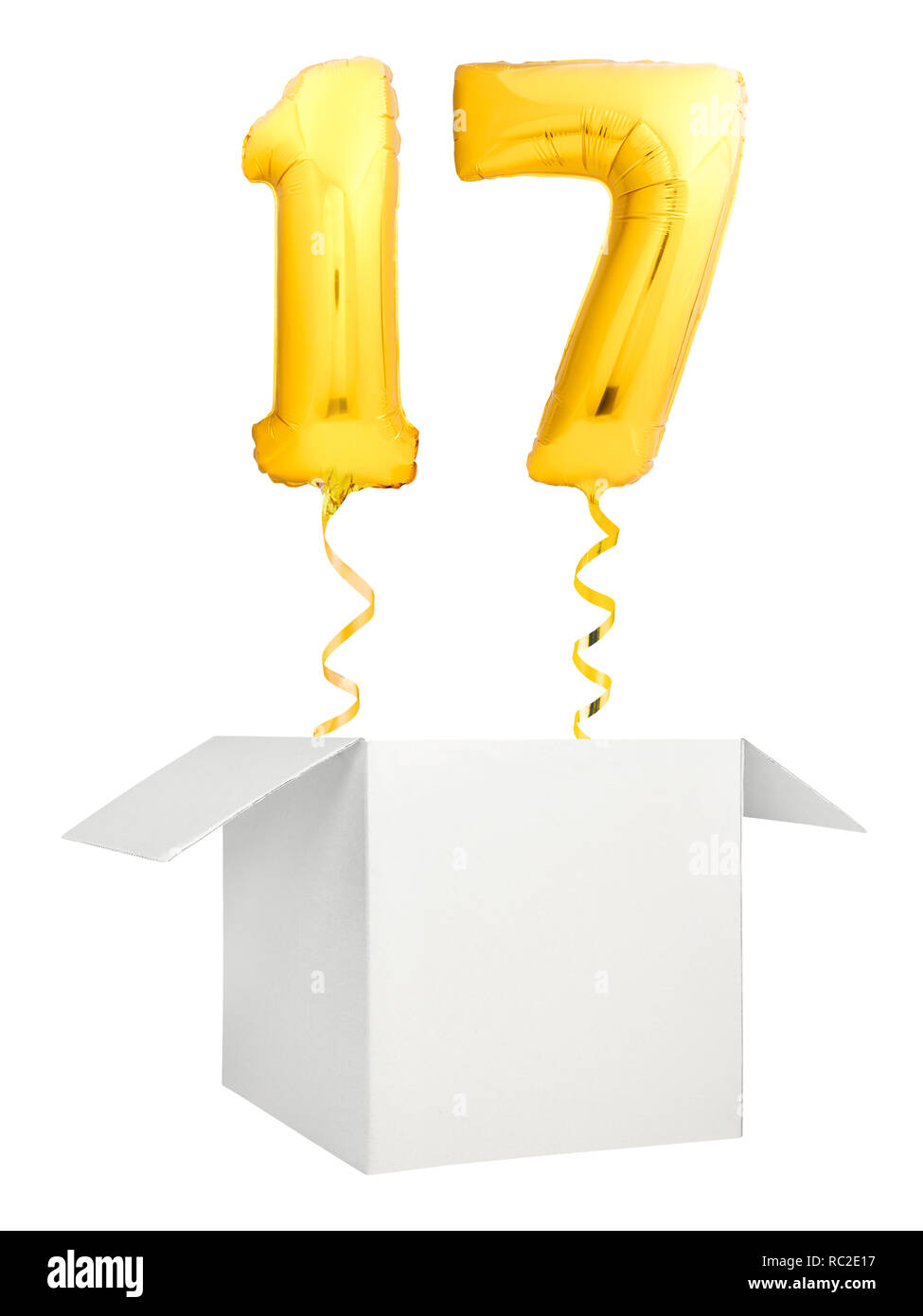 Golden number seventeen balloon flying out of blank white box isolated ...