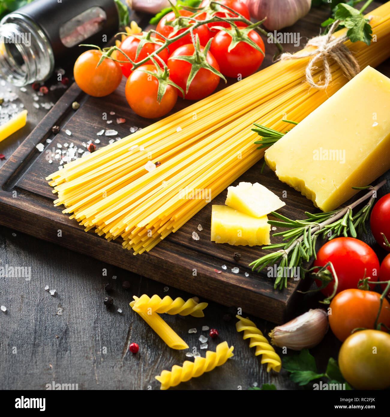Raw Italian pasta spaghetti and cooking ingredients Stock Photo - Alamy