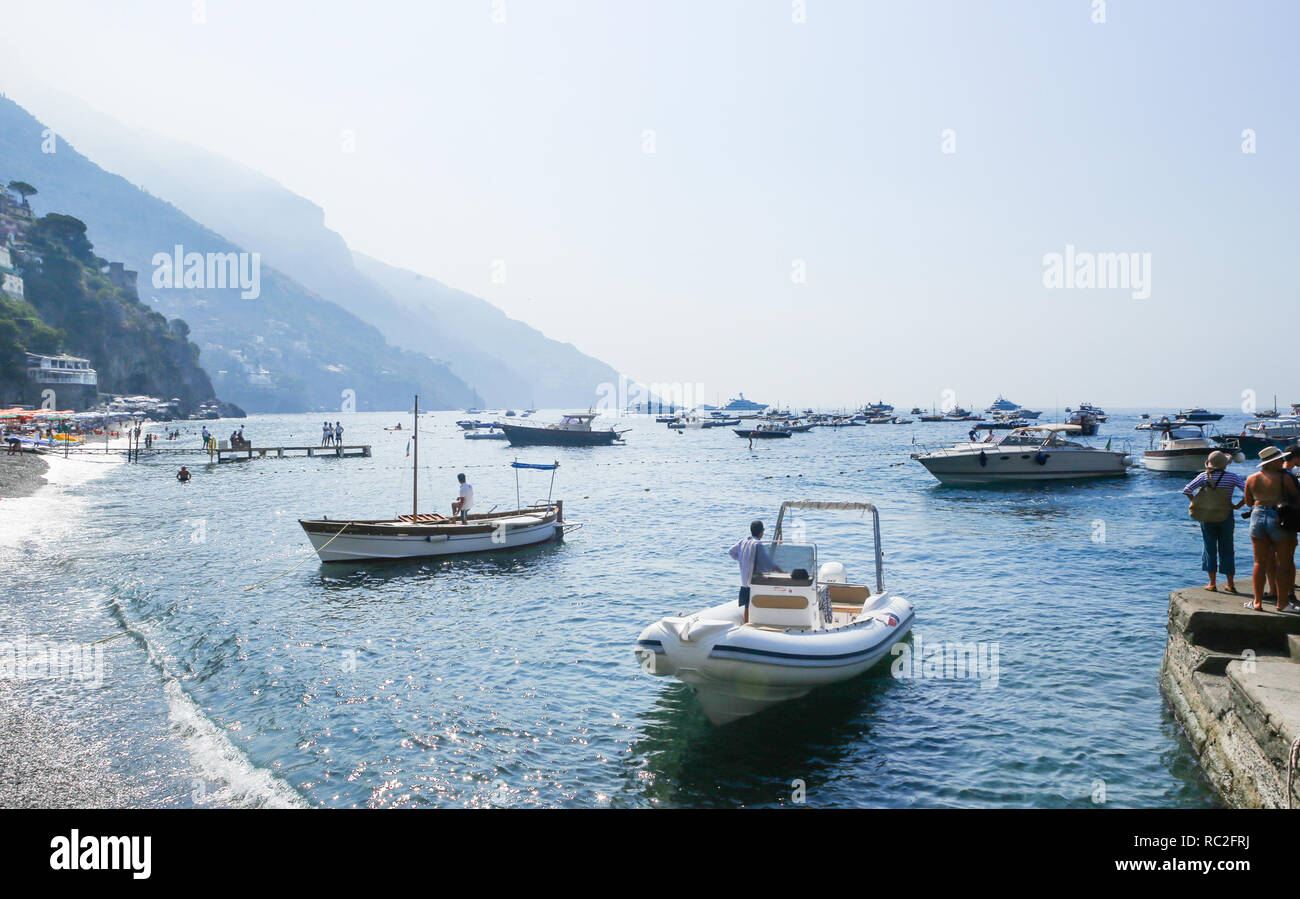 Tourist ships in visitfamous and picturesque port in Positano. Italy ...