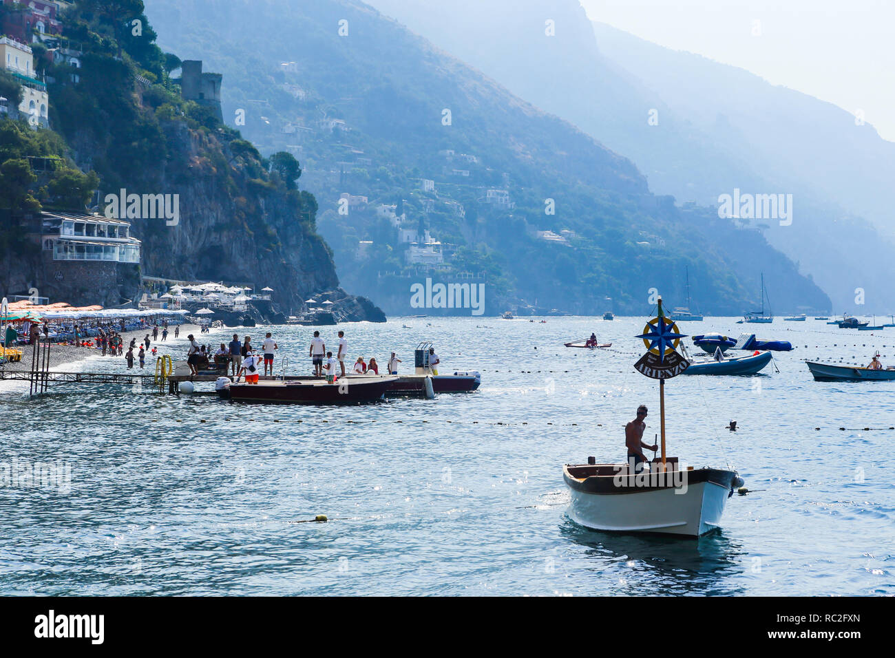 Tourist ships in visitfamous and picturesque port in Positano. Italy ...
