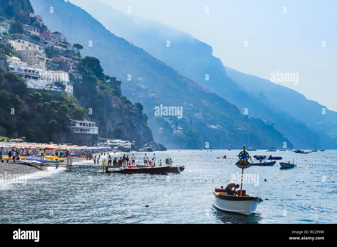 Tourist ships in visitfamous and picturesque port in Positano. Italy ...