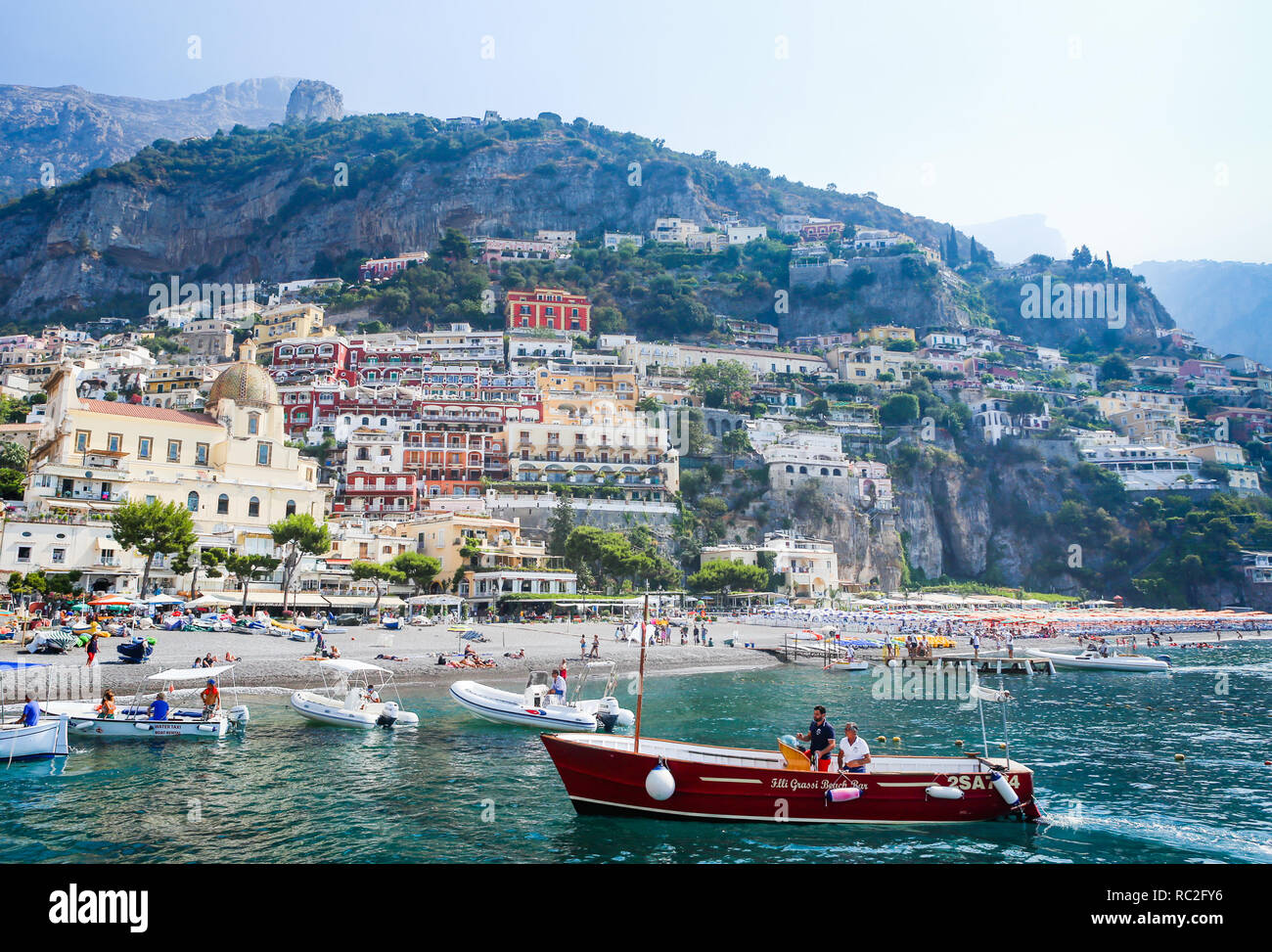 Tourist ships in visitfamous and picturesque port in Positano. Italy ...