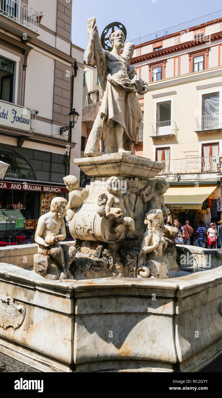 Fountain with the statue of St. Andrew in the main square of Amalfi ...