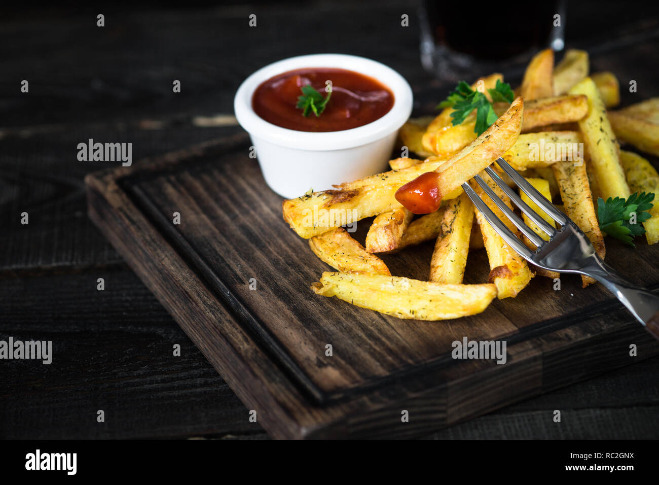 Fried potato with ketchup sauce Stock Photo - Alamy