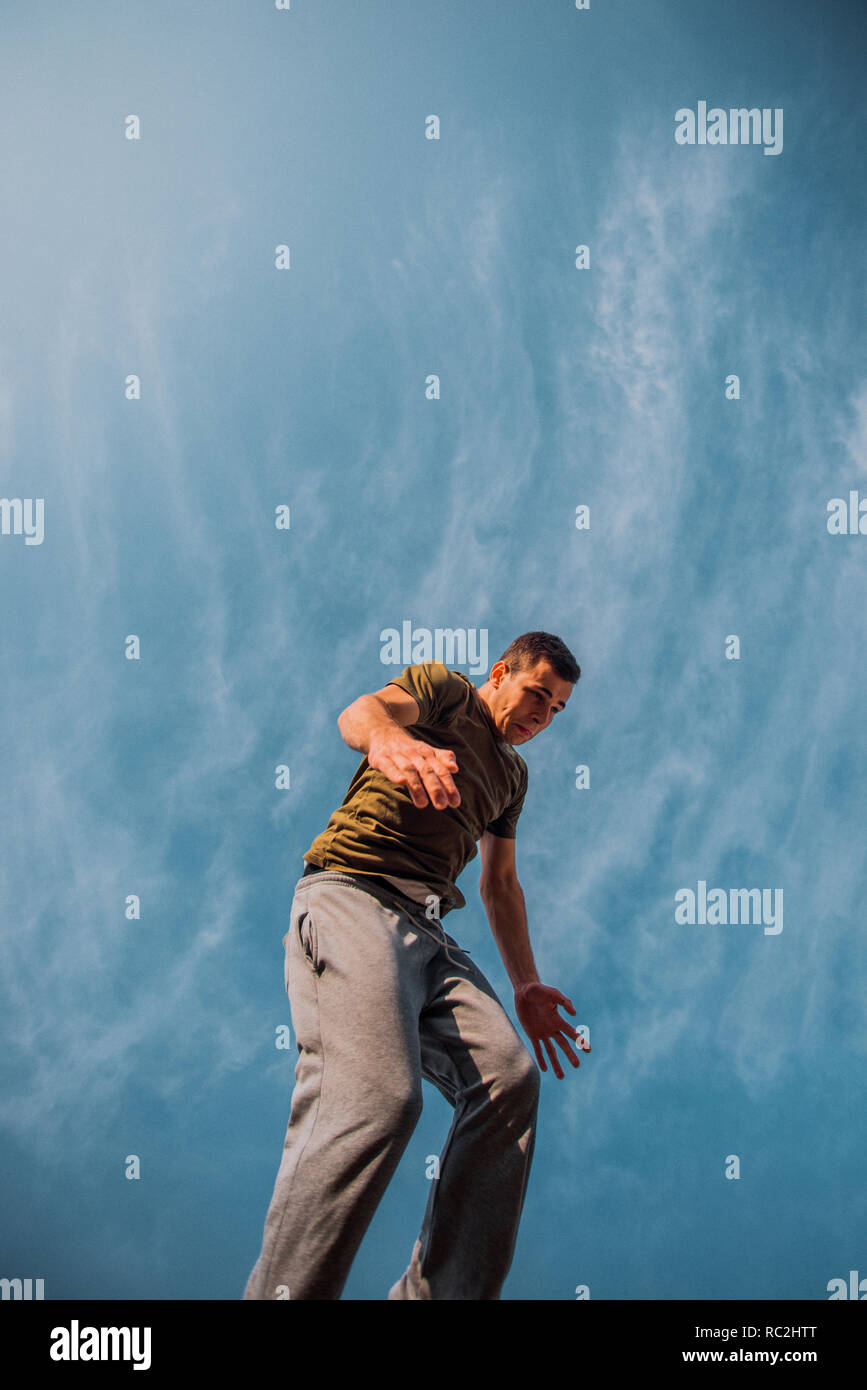 Training day of young traceur while doing parkour jumping Stock Photo ...