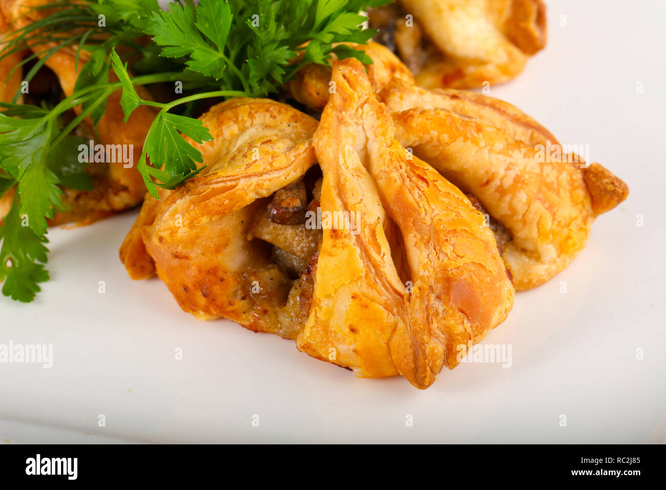 Pastry with meat served parsley Stock Photo - Alamy