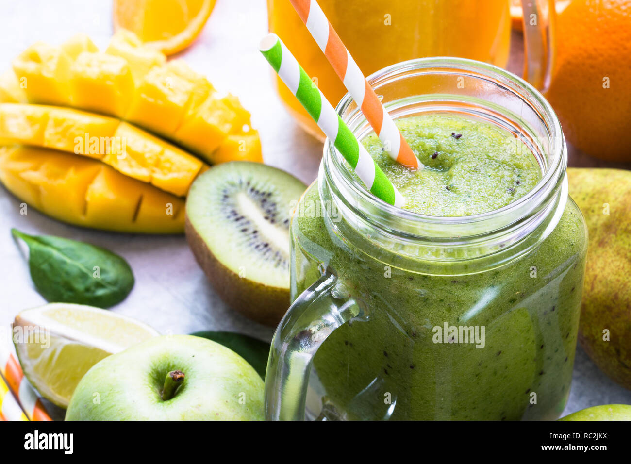 Green and yellow smoothie in mason jar Stock Photo - Alamy