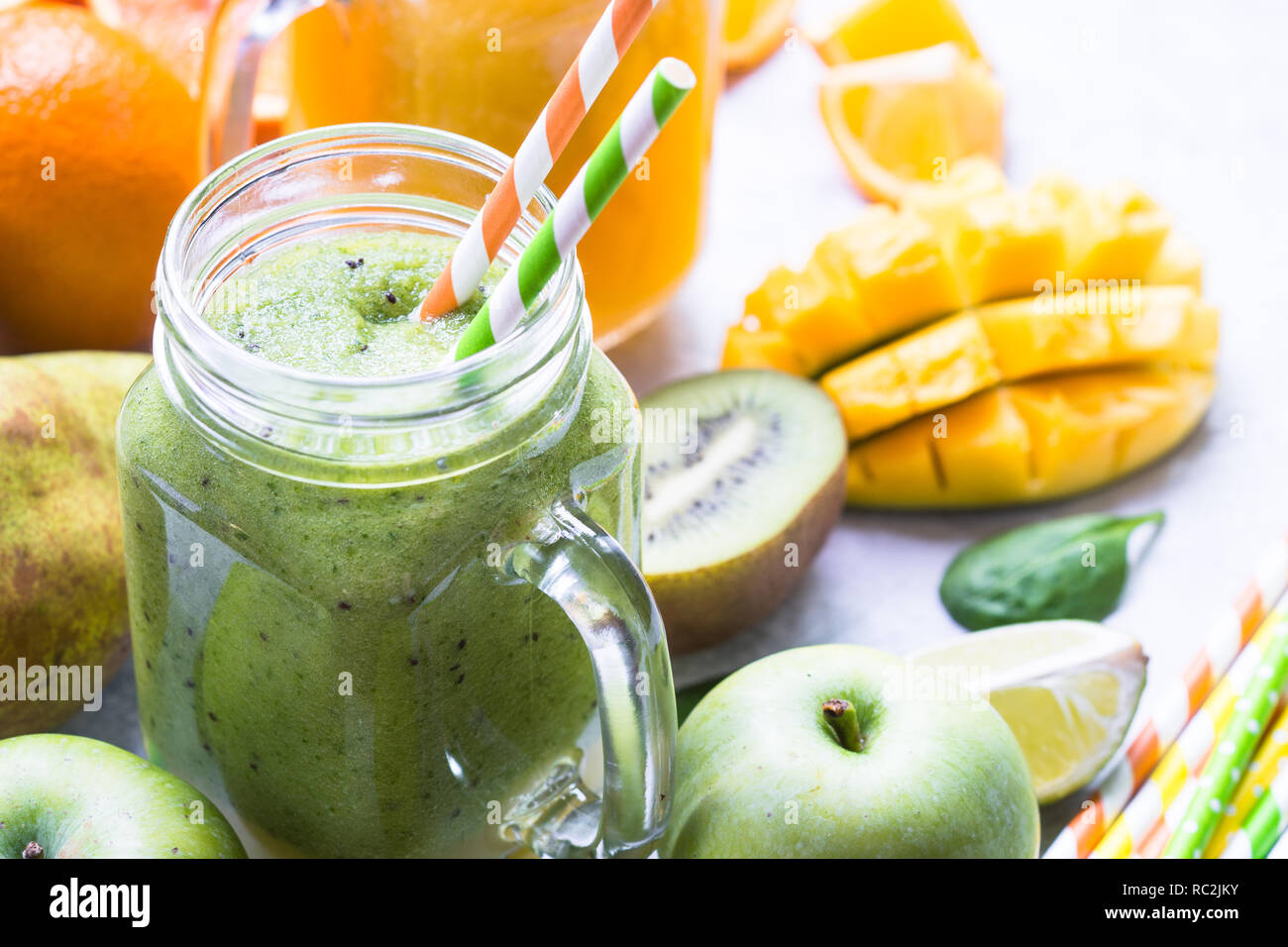 Green and yellow smoothie in mason jar Stock Photo - Alamy