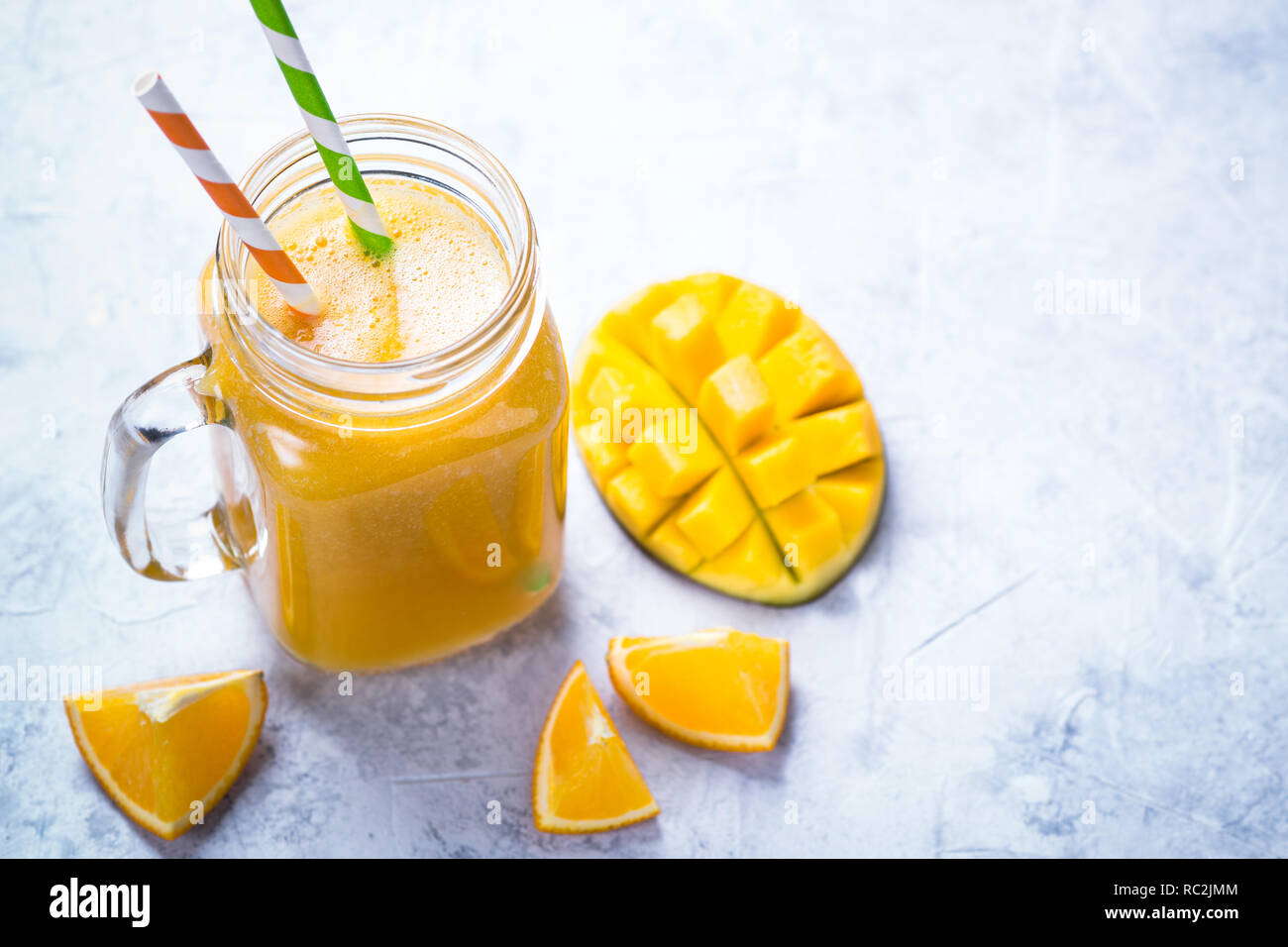 Mango orange juice smoothie Stock Photo - Alamy