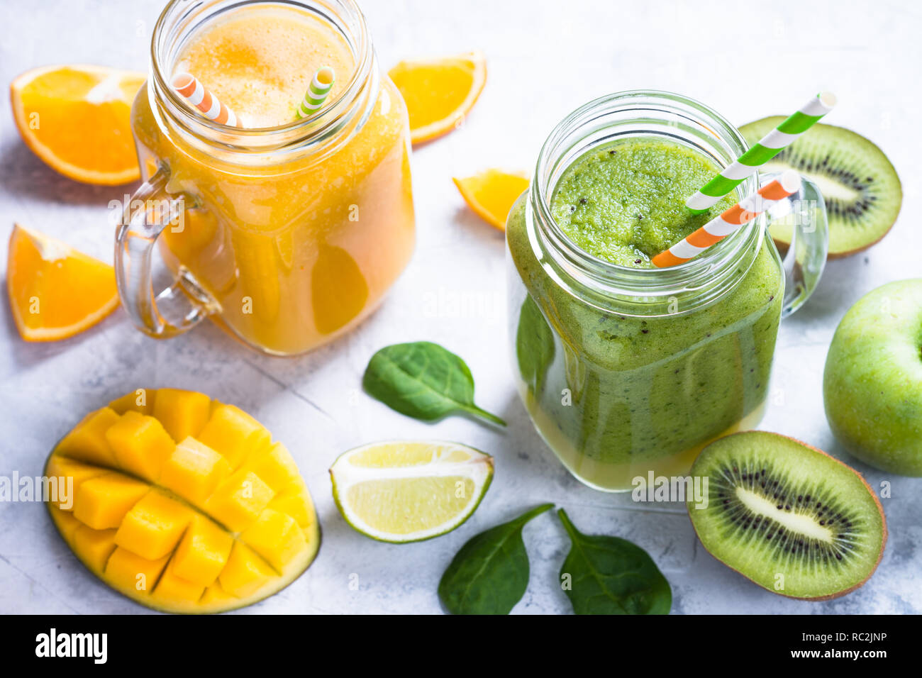 Green and yellow smoothie in mason jar Stock Photo - Alamy