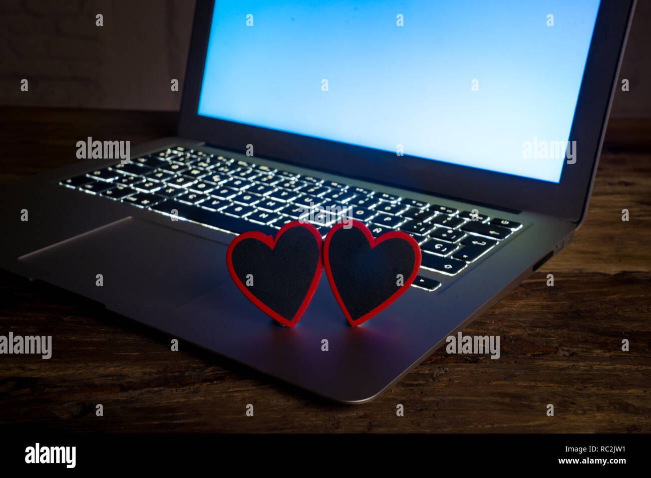 Conceptual image of text Love you in wood blocks on computer with mood ...