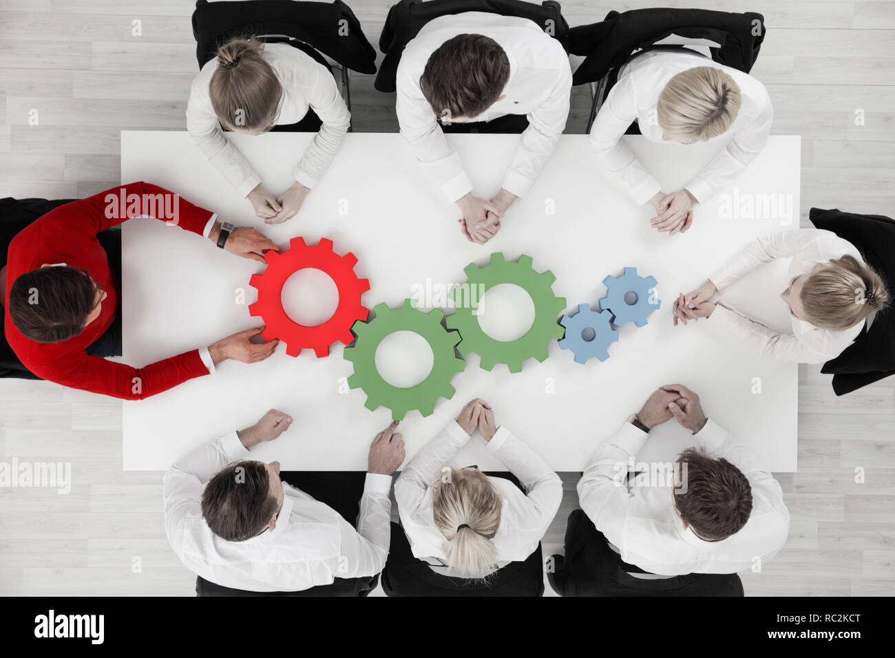 Machinery cogs with people hi-res stock photography and images - Alamy