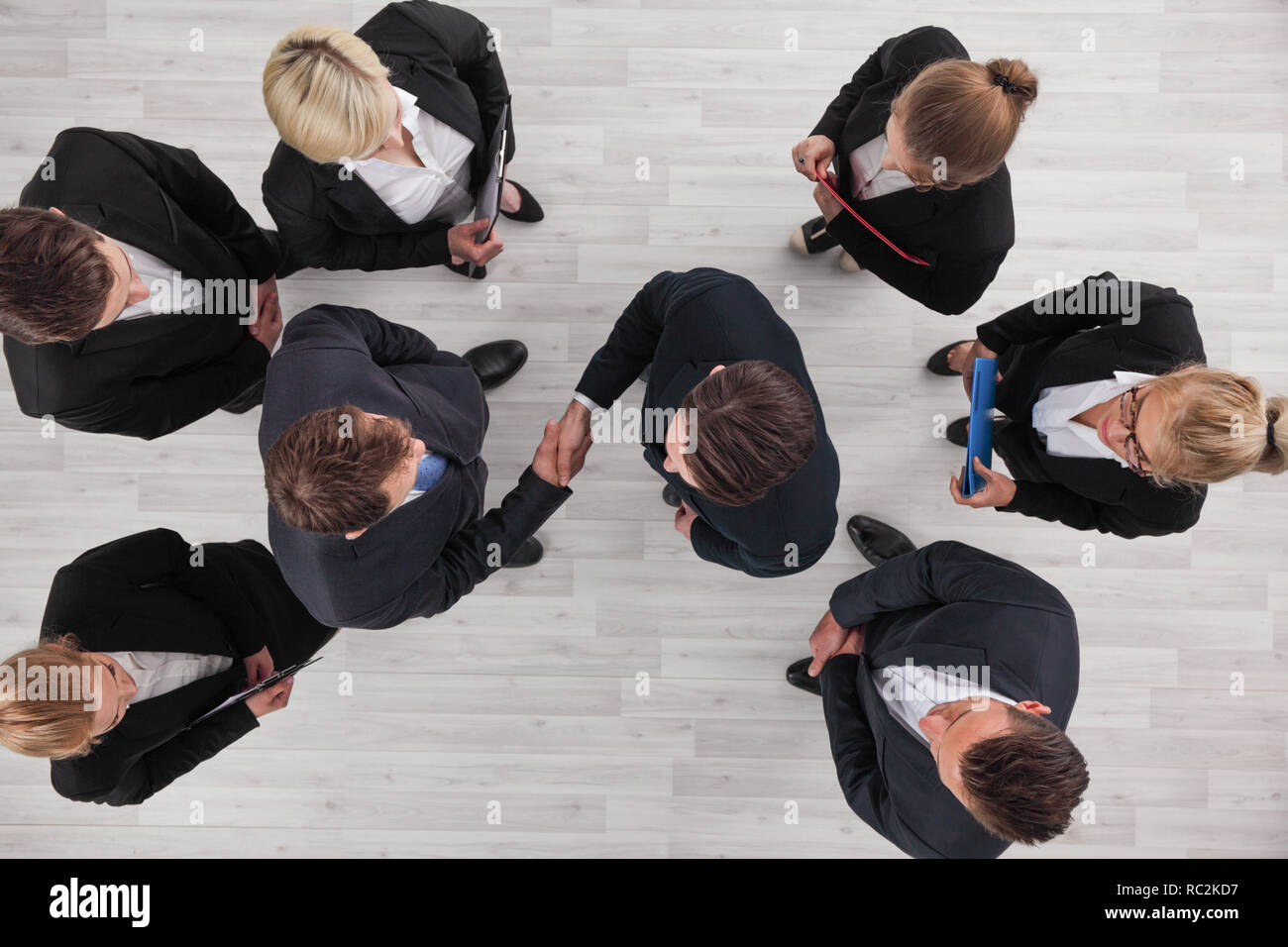 Top view of a strong handshake between two business people , business ...