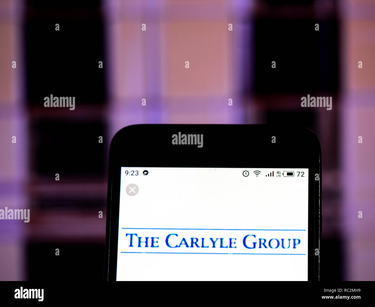 The Carlyle Group Private equity company logo seen displayed on smart ...