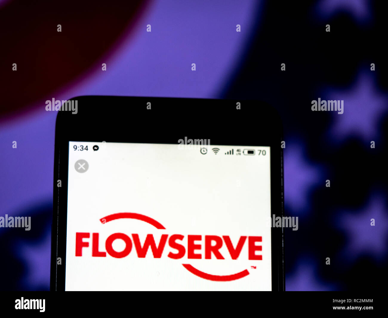 Flowserve Machinery industry company logo seen displayed on smart phone ...