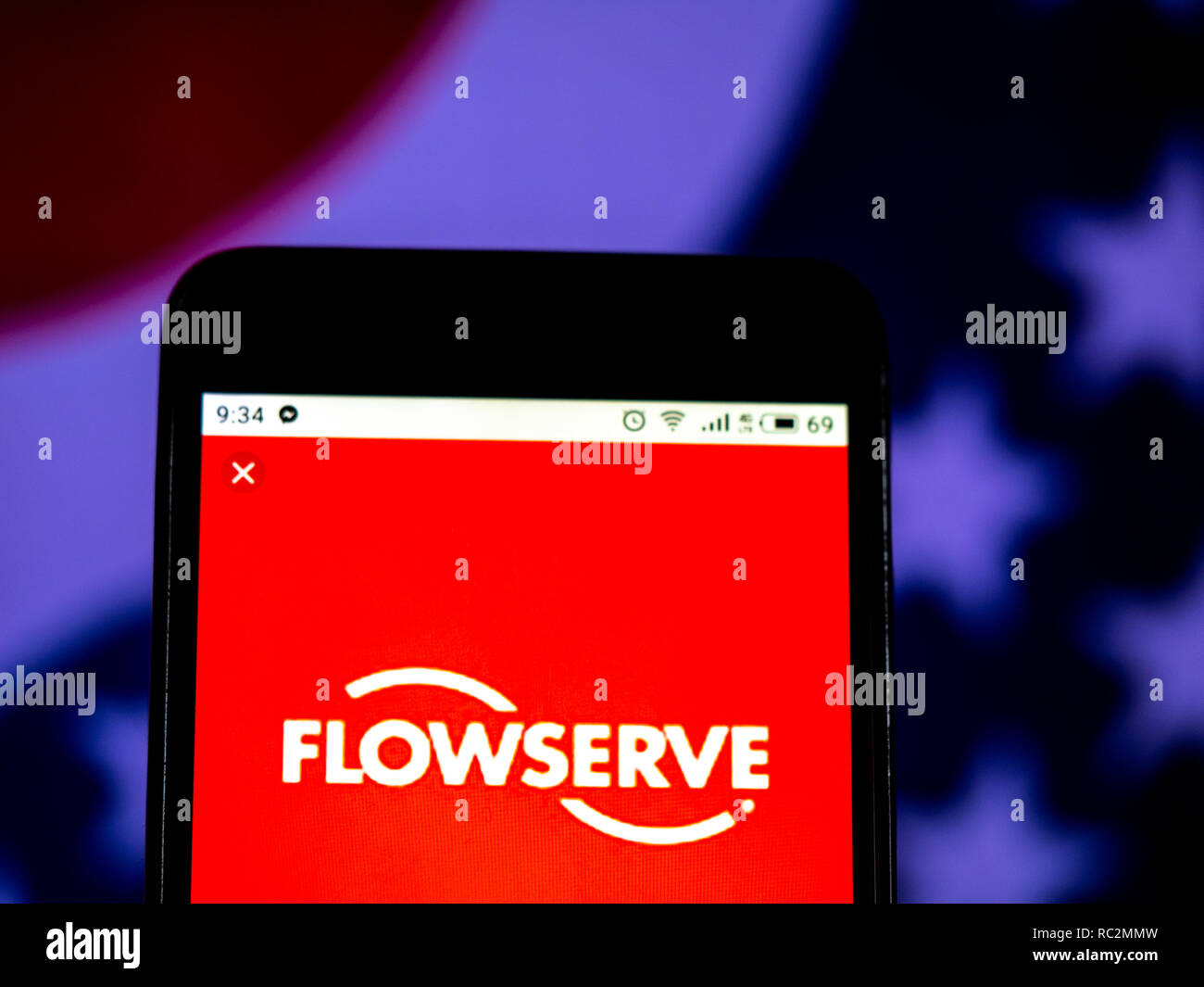 Flowserve Machinery industry company logo seen displayed on smart phone ...