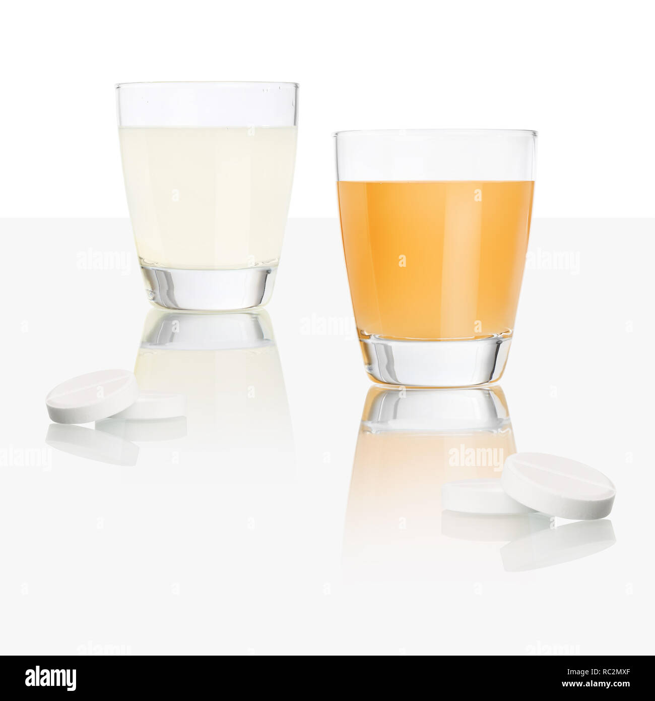 aspirin tablets and glass isolated on white table, orange and lemon ...