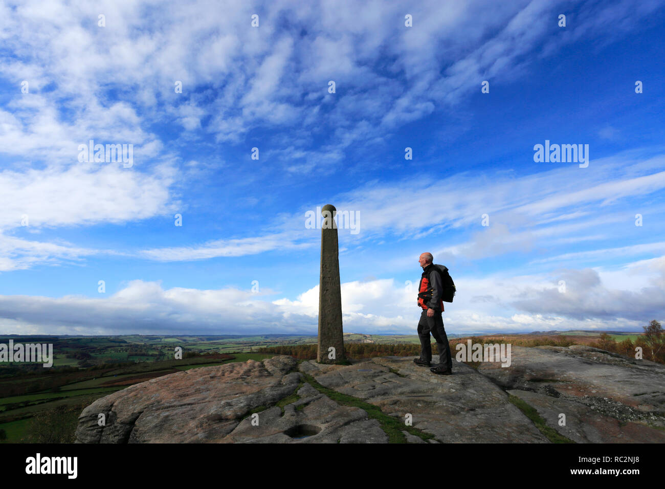 Walker at Admiral Nelsons monument, Birchen Edge, Peak District ...
