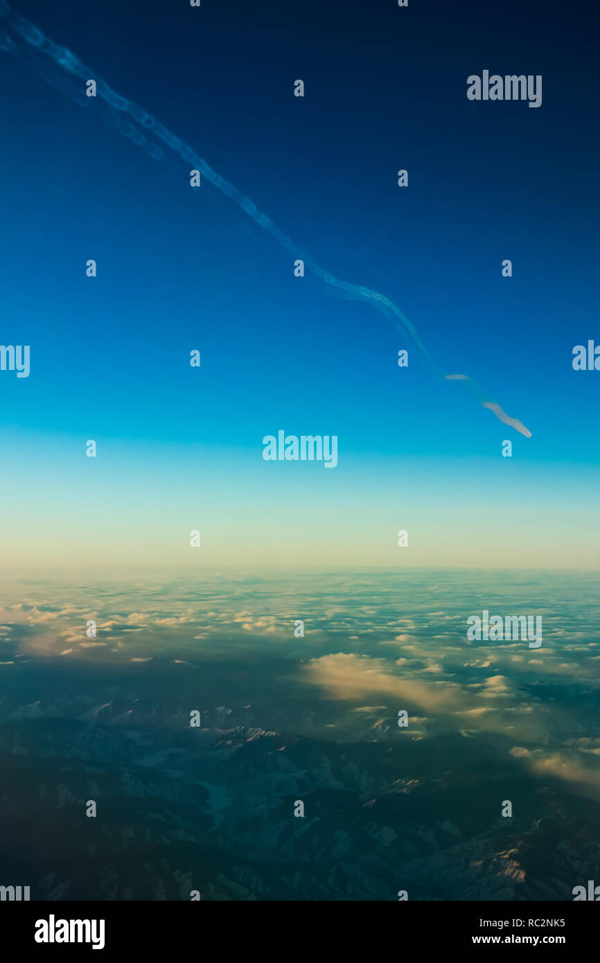 Contrail smoke rings in the skies over Russia Stock Photo - Alamy