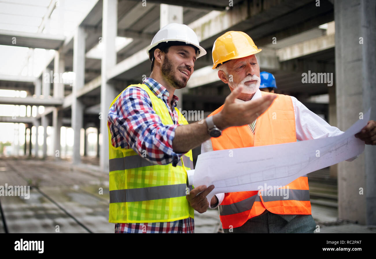 Group of construction engineer working in construction site Stock Photo ...