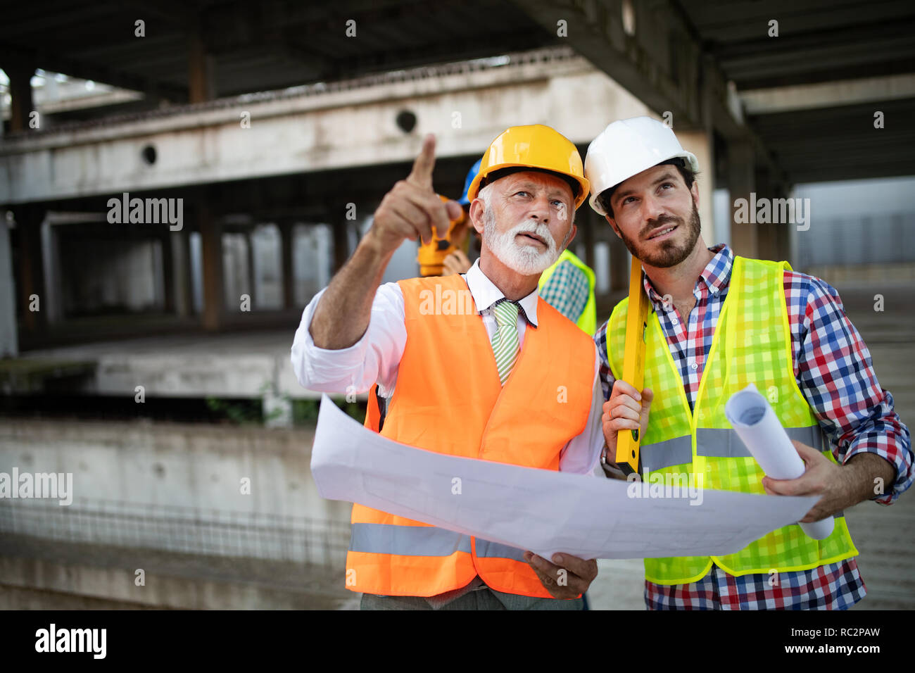 Construction worker blueprint helmet workplace hi-res stock photography ...