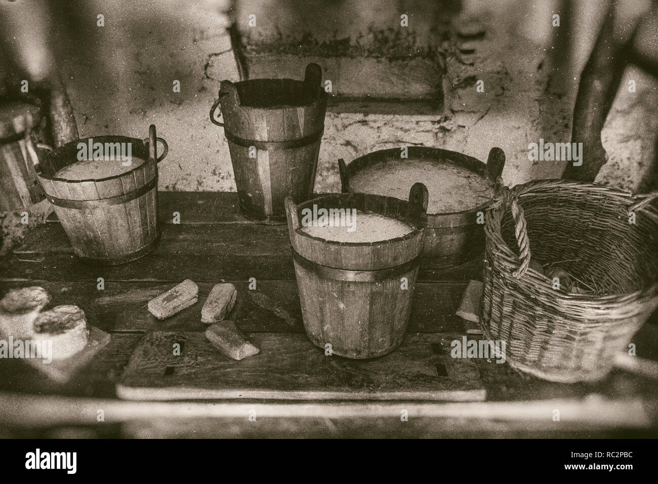 Old way of making cheese and diary products, buckets of milk, cream and ...